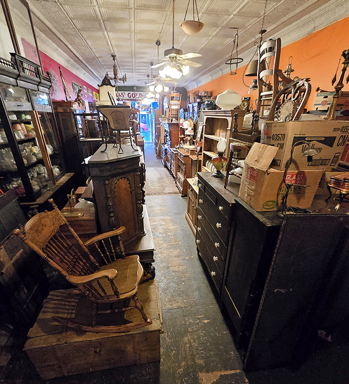 Walking this narrow path feels like traveling through time – wooden floors creaking beneath your feet as history surrounds you on all sides.