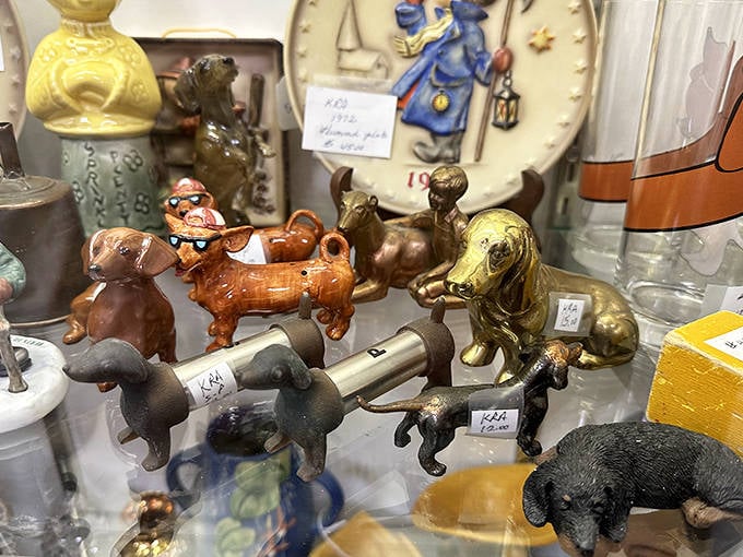 These miniature dog figurines stand guard over their display case, each with personality and charm that mass-produced items simply can't match.