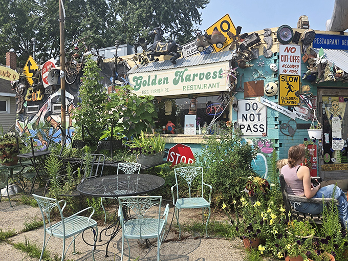 The garden oasis – where patient diners can enjoy their hard-earned breakfast amid flowers almost as colorful as the building itself.
