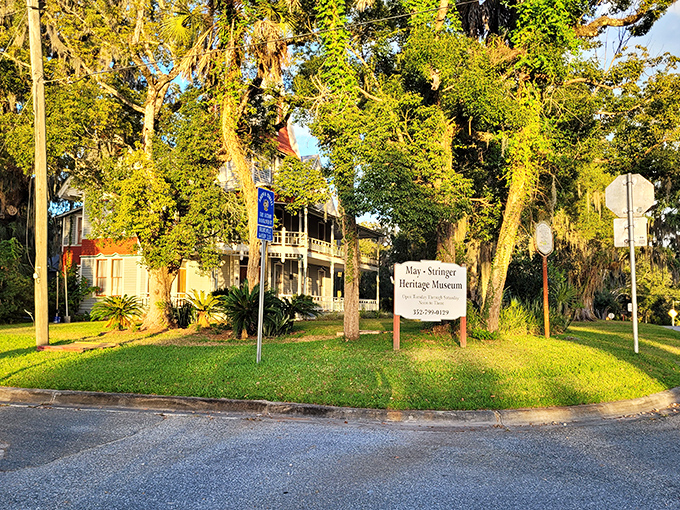 Sunlight filters through ancient oaks onto the museum grounds, creating a peaceful setting that belies the property's reputation for supernatural activity.