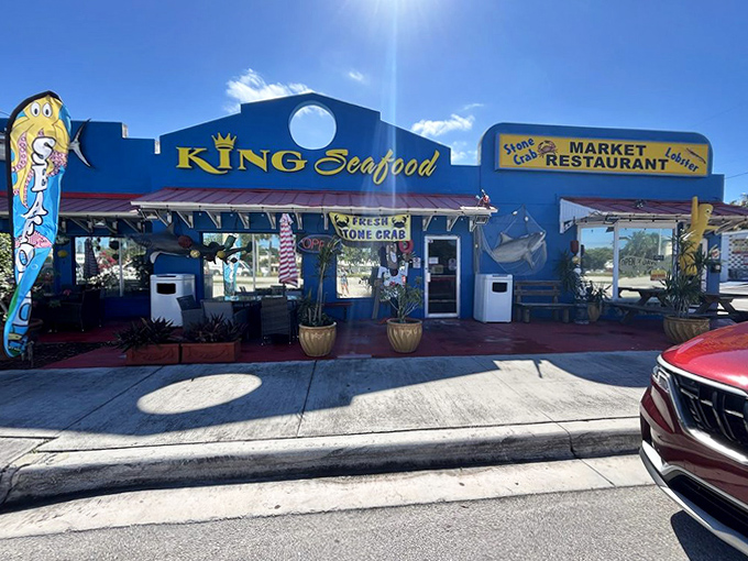 The royal blue exterior with its crown logo stands as a beacon for hungry travelers seeking authentic Keys flavors.