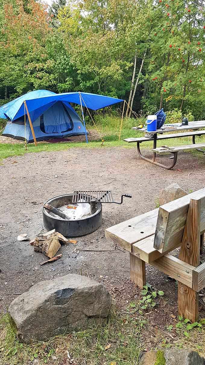 Campsite perfection: This cozy setup offers the ultimate front-yard view, with a fire pit ready for evening s'mores and storytelling.
