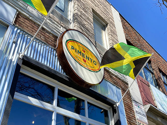 The Pimento sign and Jamaican flag announce this culinary embassy with pride &ndash; a promise of authentic flavors in every bite.