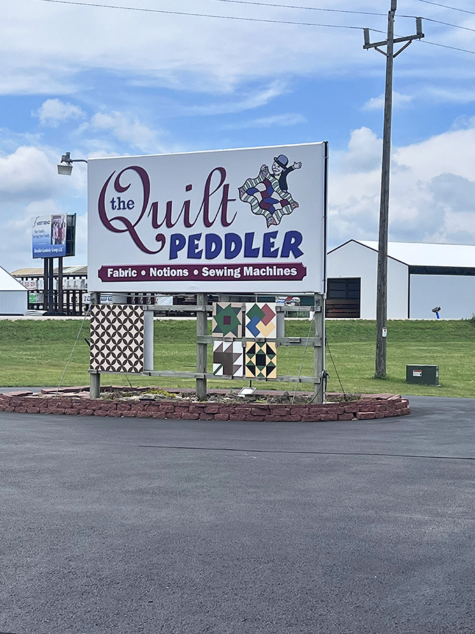 The Quilt Peddler's iconic sign serves as a beacon for fabric enthusiasts, drawing crafters from across the Midwest like moths to a creative flame.