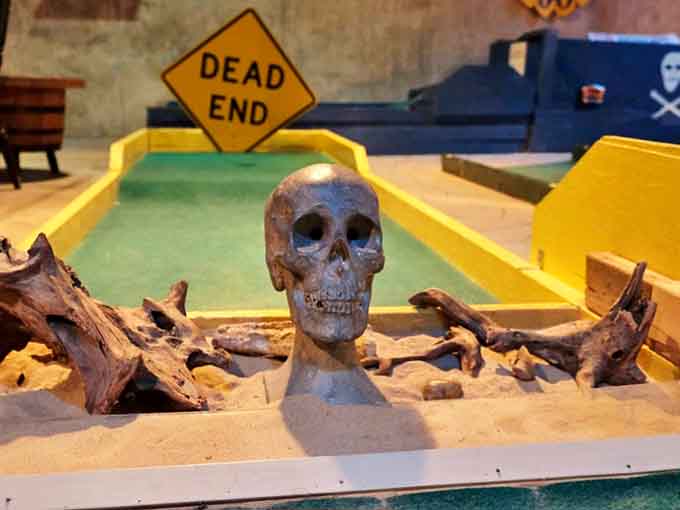 A skull with a "Dead End" sign perfectly captures the dark humor that makes this attraction so endearingly strange.
