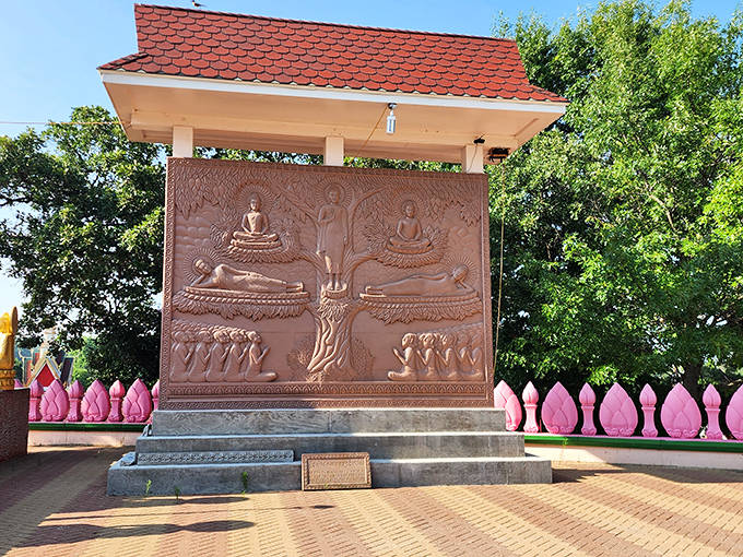 This intricate stone carving tells Buddha's enlightenment story, a narrative of transformation that mirrors the temple's own journey to the American Midwest.