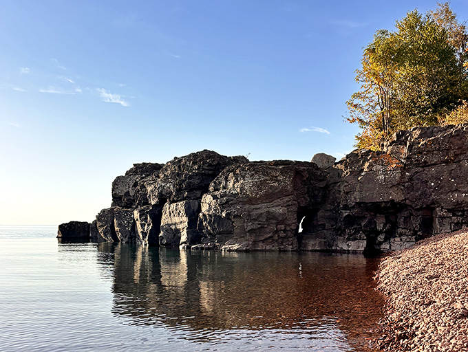 Close-up of the beach's famous pink rhyolite rocks, each one a miniature masterpiece shaped by centuries of wave action.