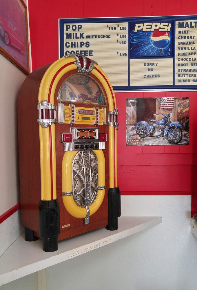 The vintage jukebox stands ready to provide the soundtrack for your meal, a working piece of history in this temple to nostalgia.