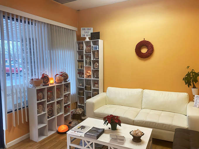 The cozy waiting room offers a peaceful transition space where the outside world starts to fade before you even enter the salt room.