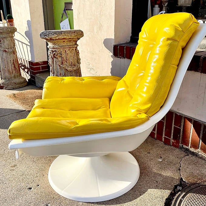 That audacious yellow chair makes a bold statement against the shop's neutral backdrop &ndash; proving vintage doesn't have to mean subdued.