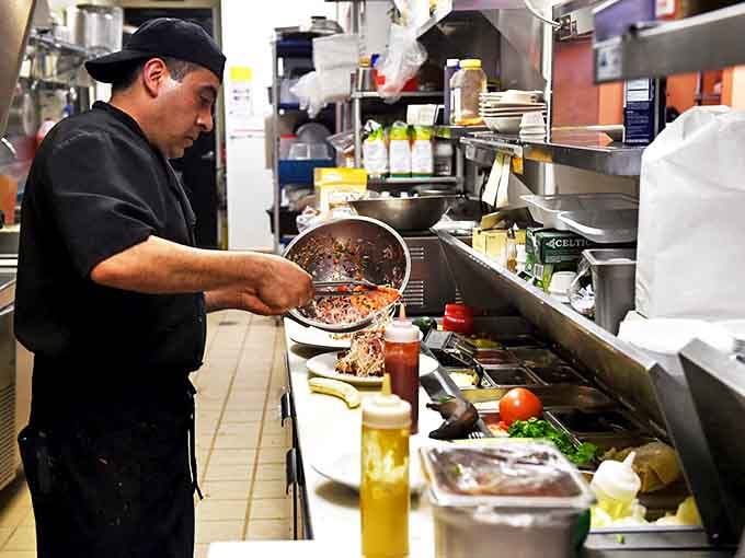 In the kitchen, culinary magic happens as traditional recipes come to life, each dish prepared with the care of a family heirloom.