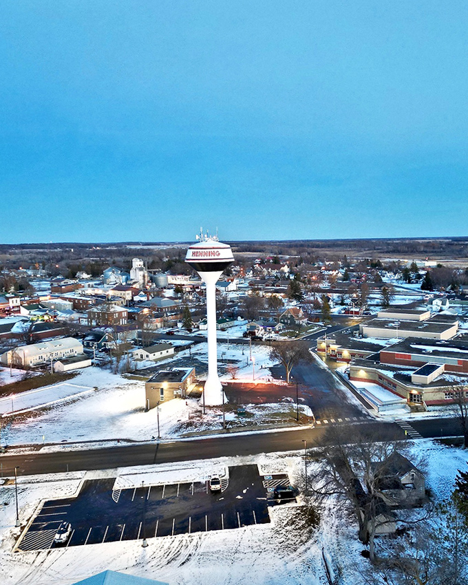 Winter blankets Henning in snow, the water tower standing sentinel over sleeping streets like a watchful parent checking on slumbering children.