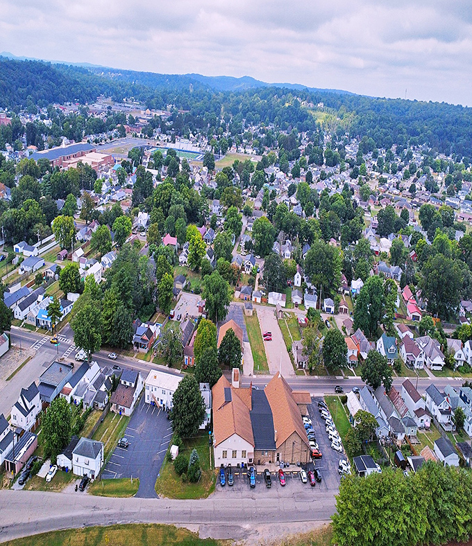 Aerial views reveal a town nestled among trees and hills, proving that good things really do come in small packages.