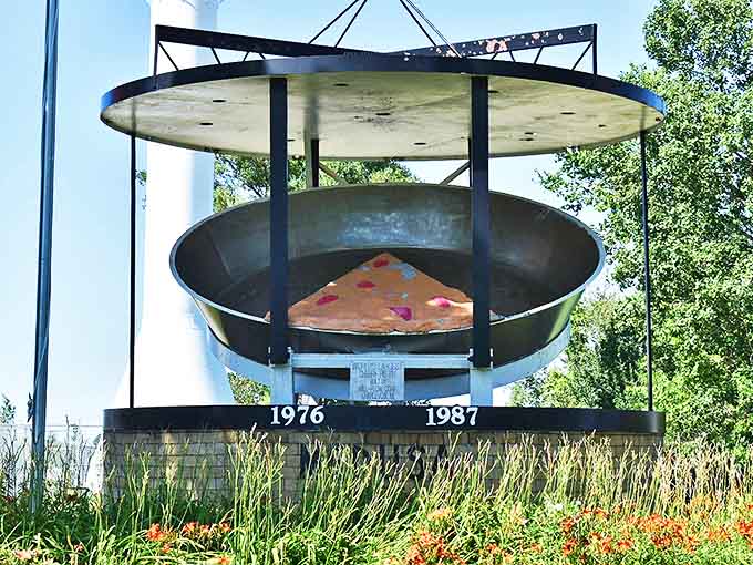 The covered display protects a replica of the famous pie, ensuring future generations can marvel at Traverse City's moment of pastry glory.