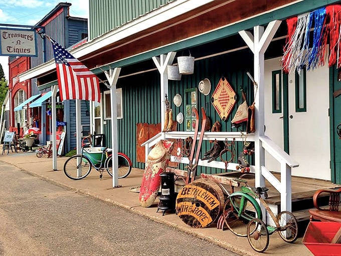 The front porch at Treasures-n-Tiques isn't just an entrance &ndash; it's an outdoor gallery of Americana where vintage bicycles and weathered barrels create irresistible curb appeal.