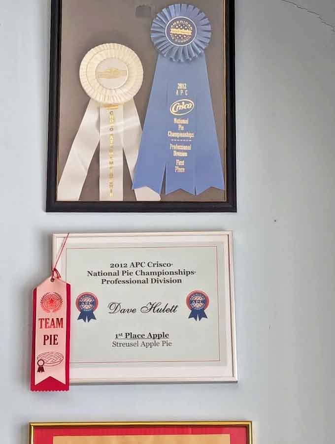 Award ribbons and certificates on display tell the story of recognition well-deserved &ndash; these pies don't just taste good, they're officially excellent.