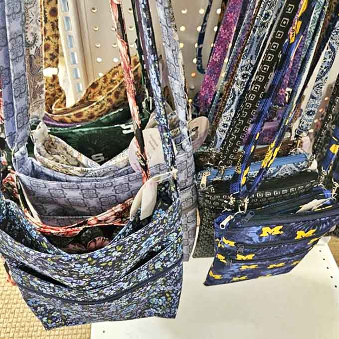 Colorful fabric bags hang in orderly rows, proving that even practical items can be beautiful &ndash; yesterday's craftsmanship waiting for tomorrow's adventures.