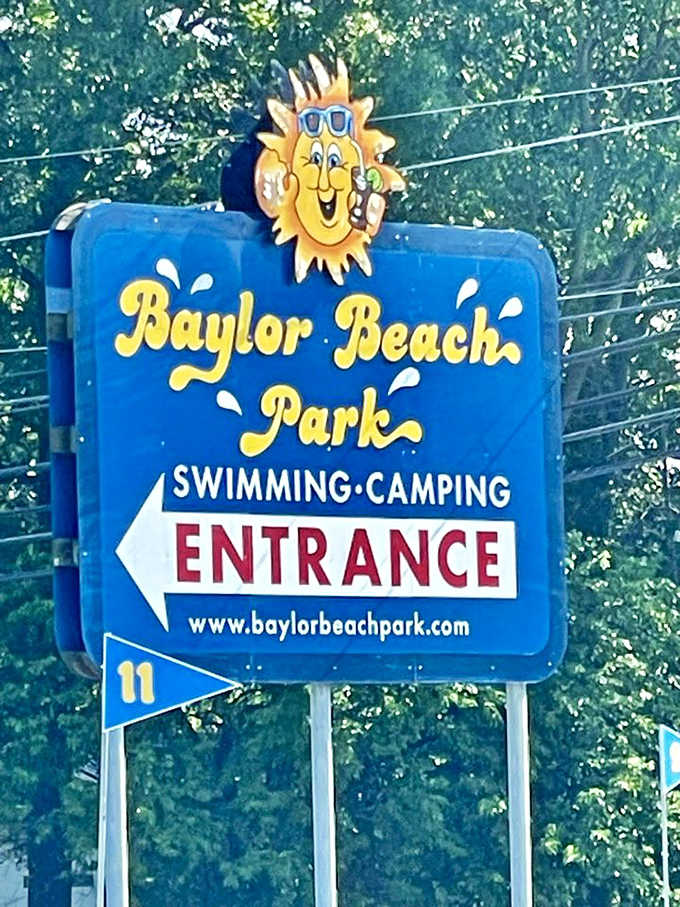 The iconic entrance sign with its cheerful sun mascot welcomes visitors to a place where summer feels exactly as it should.
