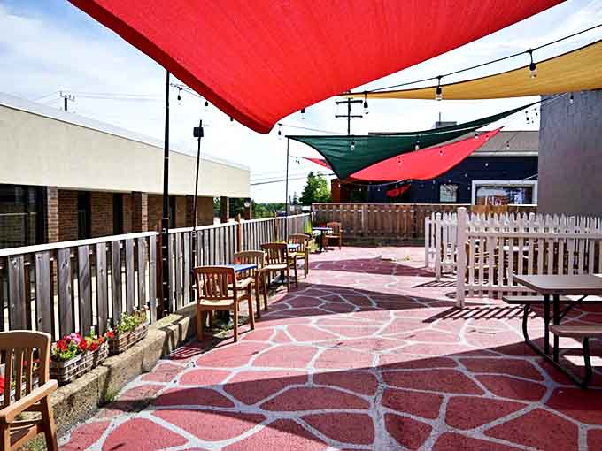 The outdoor patio &ndash; where colorful shade sails and simple wooden tables create the perfect backdrop for memory-making meals on Michigan evenings.