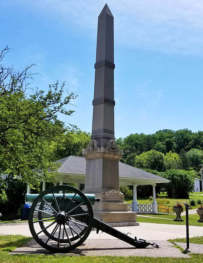 The Civil War Monument stands as a solemn reminder of sacrifice, its stone sentinel watching over the town through changing seasons.