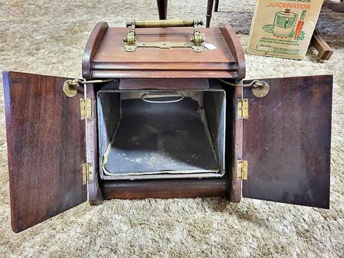 This vintage coal scuttle represents the elegant practicality of pre-electric home life &ndash; functional objects designed with beauty and durability in mind.