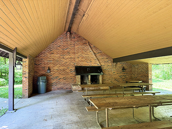 The park's covered picnic shelter, with its rustic brick fireplace, provides a gathering space that feels both timeless and invitingly communal.