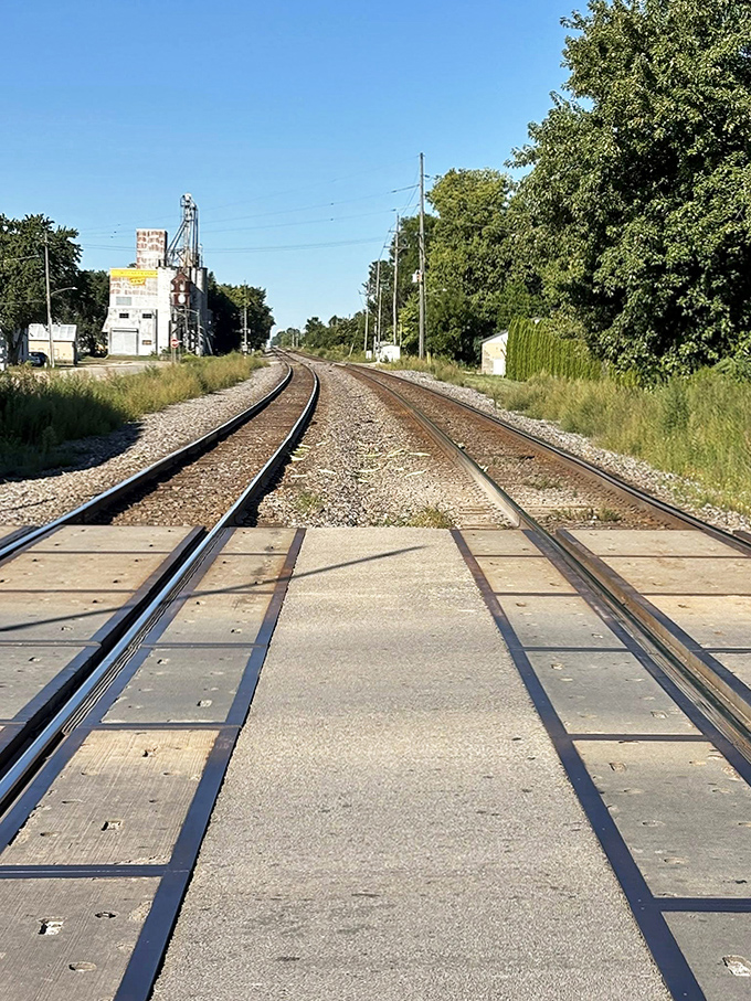 Train tracks curve into the distance, symbolic of Sandwich's journey through time &ndash; still connected to its past while moving forward.
