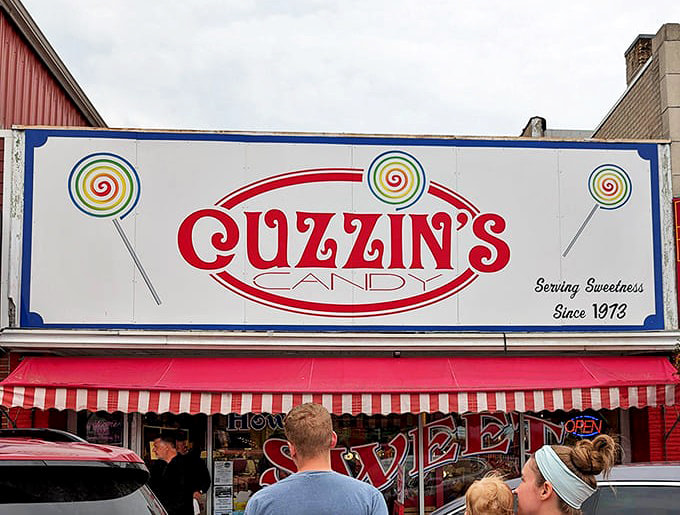 The exterior signage, complete with lollipop graphics, announces that serious candy business happens here daily.