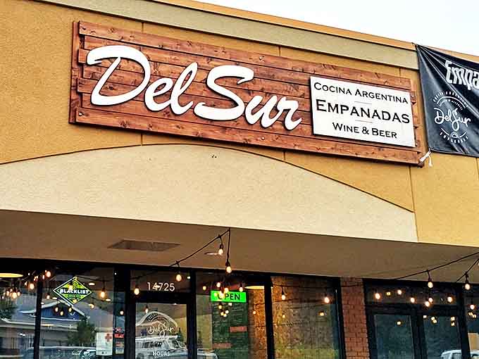 The wooden DelSur sign serves as a beacon for empanada enthusiasts. "Cocina Argentina" tells you everything you need to know about the authentic experience waiting inside.