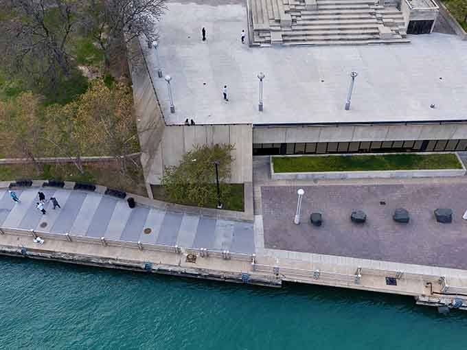 A bird's-eye view reveals the RiverWalk's thoughtful design, where concrete paths and green spaces create a perfect ribbon along Detroit's watery edge.