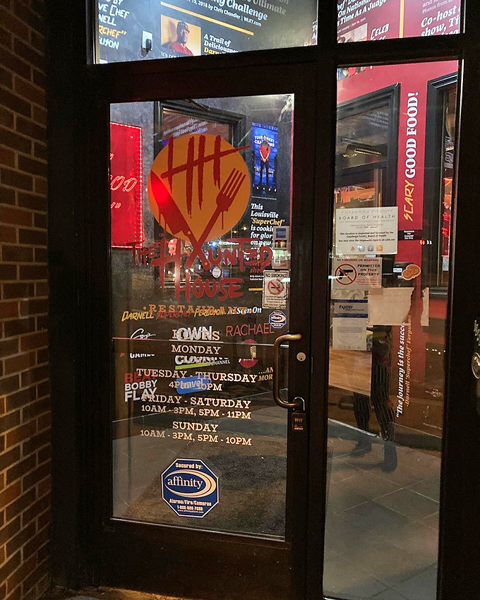 Business hours posted on the door &ndash; your invitation to step into a world where horror movies and culinary creativity collide deliciously.