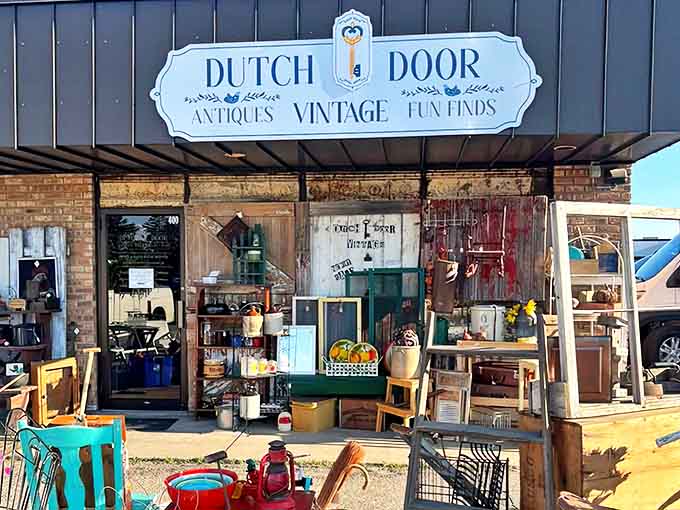 The exterior view showcases Dutch Door Antiques' welcoming facade, where vintage finds spill outward, giving passersby a tantalizing preview of treasures within.