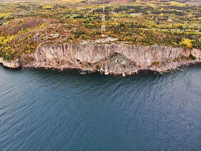 This aerial perspective reveals Palisade Head's commanding position on Minnesota's North Shore, a natural fortress overlooking the greatest of lakes.