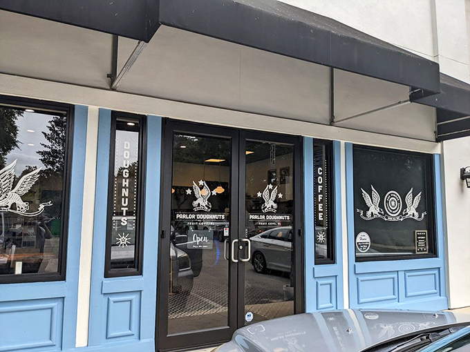 The welcoming entrance with its blue accents and eagle motifs &ndash; like the gateway to a sweeter, more delicious dimension of breakfast possibilities.