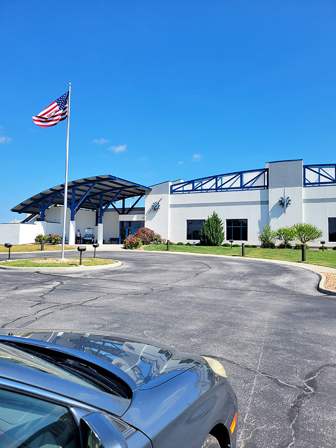 The museum entrance welcomes visitors with a proud American flag &ndash; a fitting gateway to an experience that celebrates both aviation history and classic American dining.