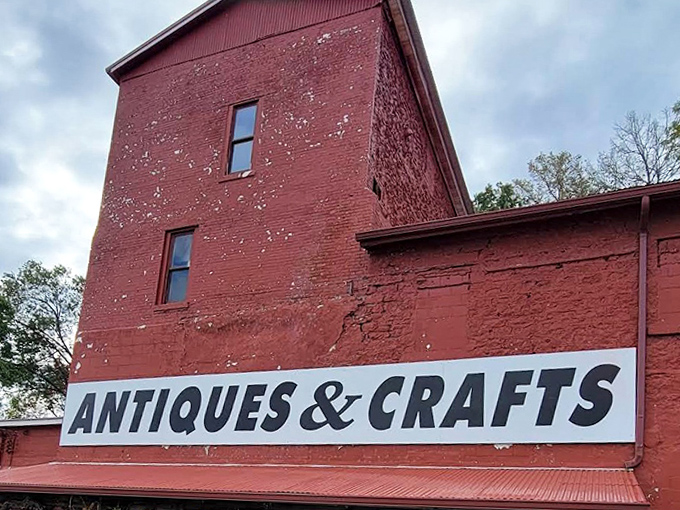 The weathered "Antiques & Crafts" sign promises adventures in time travel for anyone willing to step through these historic doors.