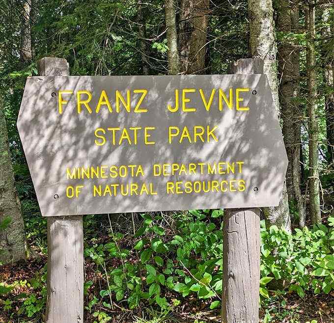 The official park sign stands as a humble introduction to a place that consistently exceeds expectations despite its modest size.