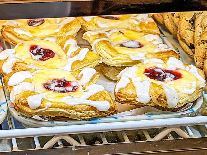 Fruit Danishes: Flaky pastry cradles bright fruit filling like a mother holding her newborn &ndash; a more sophisticated cousin to the donut, equally worthy of devotion.