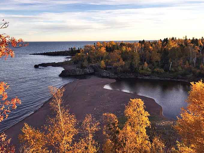 Fall's fiery display frames this perfect view of Agate Beach, where river and lake create a natural harbor.