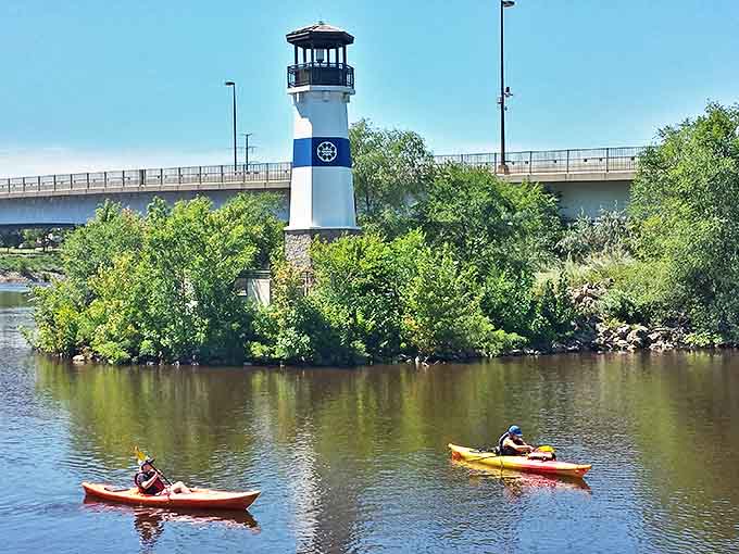 Kayakers enjoy a unique water-level perspective of the lighthouse, experiencing the Mississippi River as early settlers once did.