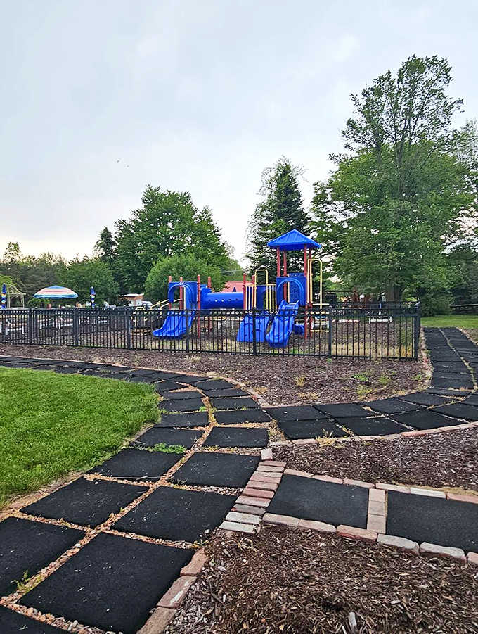 A playground where kids can run wild while parents finish their ribs in blessed, uninterrupted peace.