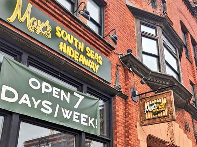 The inviting exterior signage promises "OPEN 7 DAYS A WEEK"—a year-round tropical getaway in the heart of Michigan.