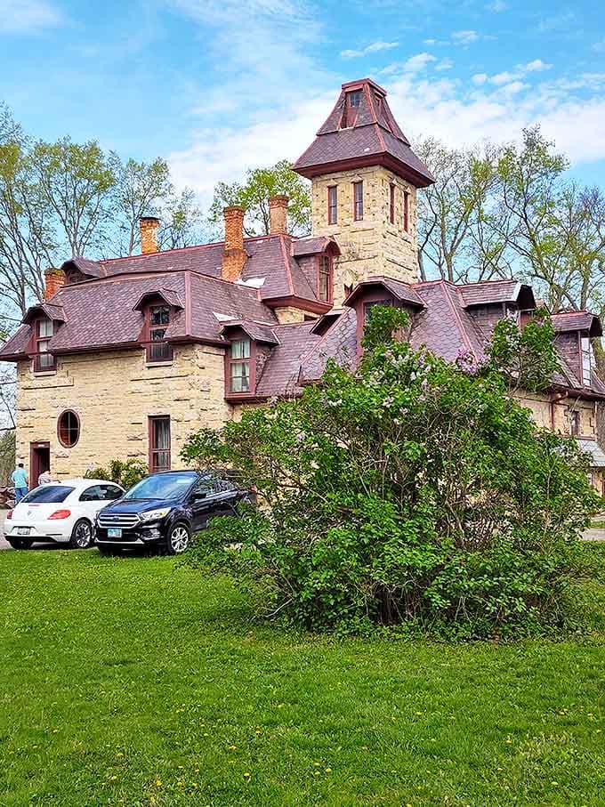 Mac-A-Cheek's impressive exterior blends Gothic Revival elements with practical Midwestern sensibilities, creating an architectural marvel that's uniquely American.