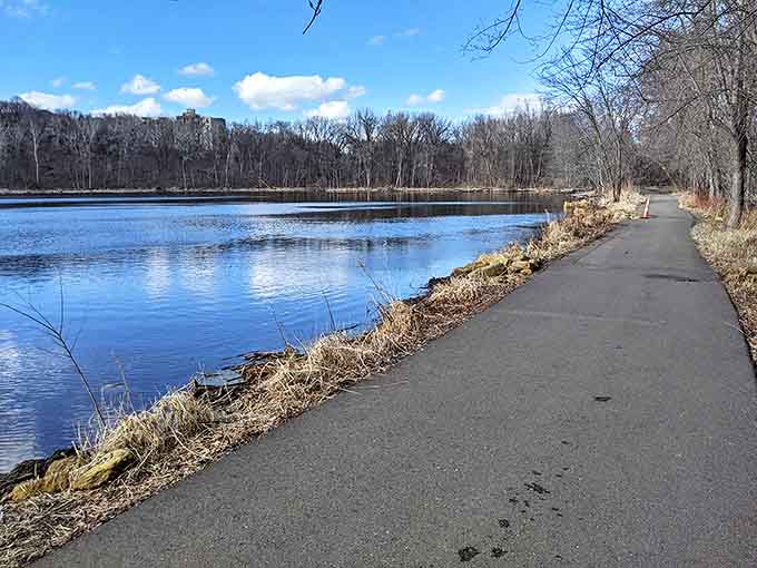 The paved trail hugs the shoreline, offering accessibility to nature's splendor for visitors of all mobility levels.