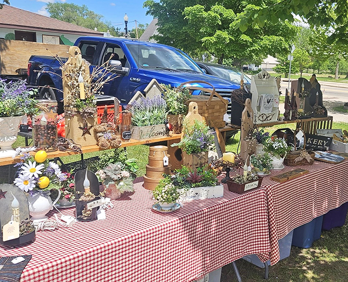 Handcrafted home decor fills tables with signs, decorations, and items that will make your house look either charmingly rustic or pleasantly cluttered, depending on perspective.