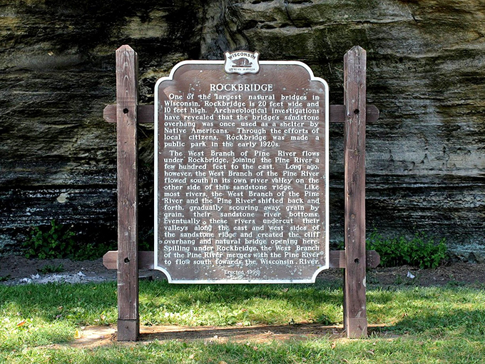 A historical marker stands guard, translating the silent story these rocks have been telling for millennia.