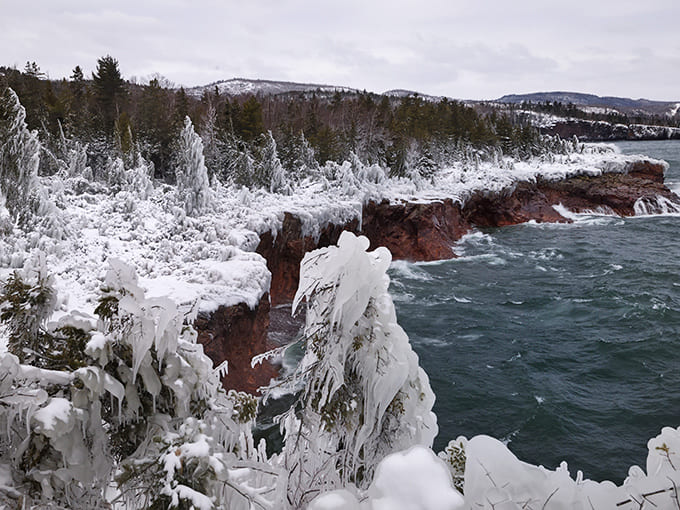 Winter transforms Shovel Point into a frozen wonderland, where ice sculptures form along the dramatic shoreline.