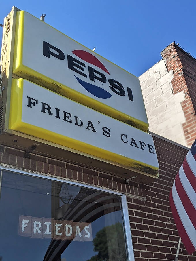 That Pepsi sign has weathered decades of Minnesota winters, standing guard over countless perfect breakfasts and community gatherings inside Frieda's welcoming walls.