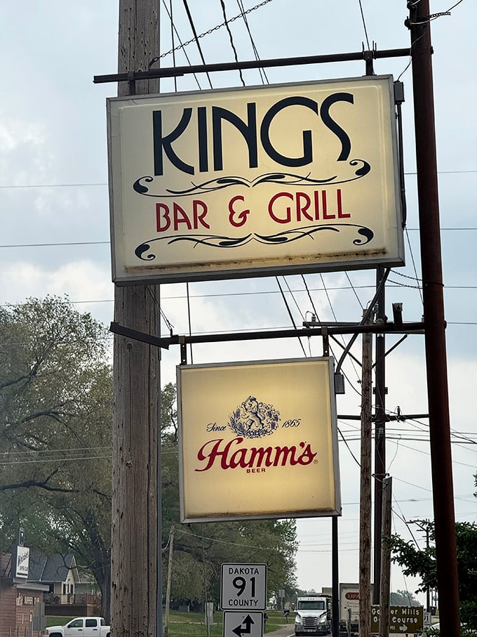 The unmistakable King's Bar & Grill sign stands as a beacon for burger pilgrims seeking flavor nirvana in Miesville.