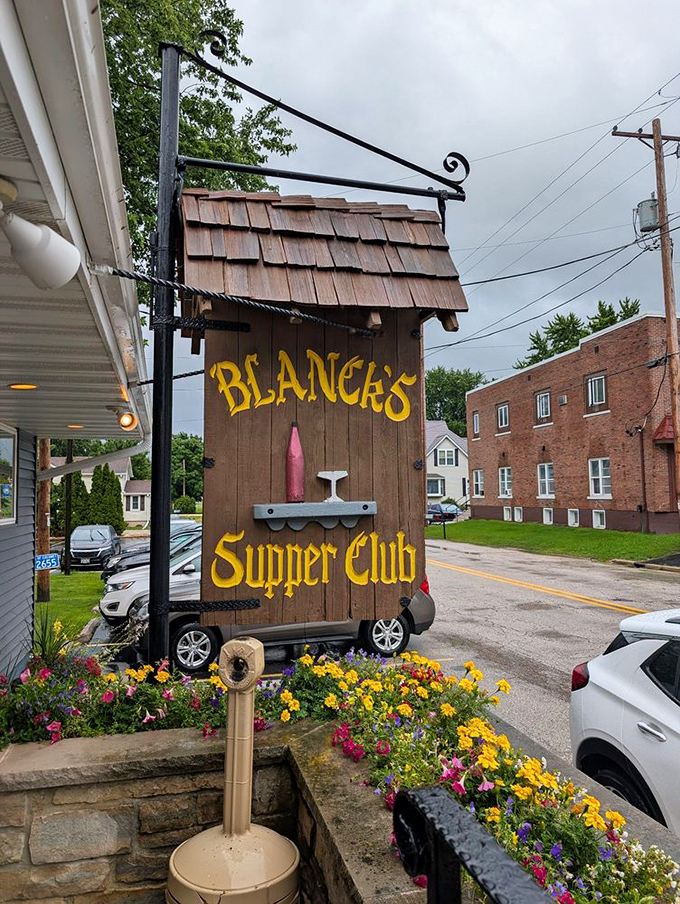 The iconic wooden Blanck's Supper Club sign, a beacon for hungry travelers and a symbol of Wisconsin's rich culinary heritage that continues to thrive.